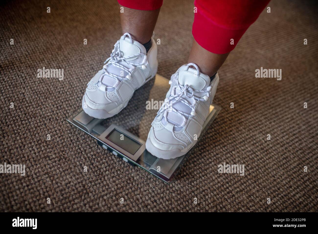 Close up picture of human feet on weighing machine Stock Photo - Alamy