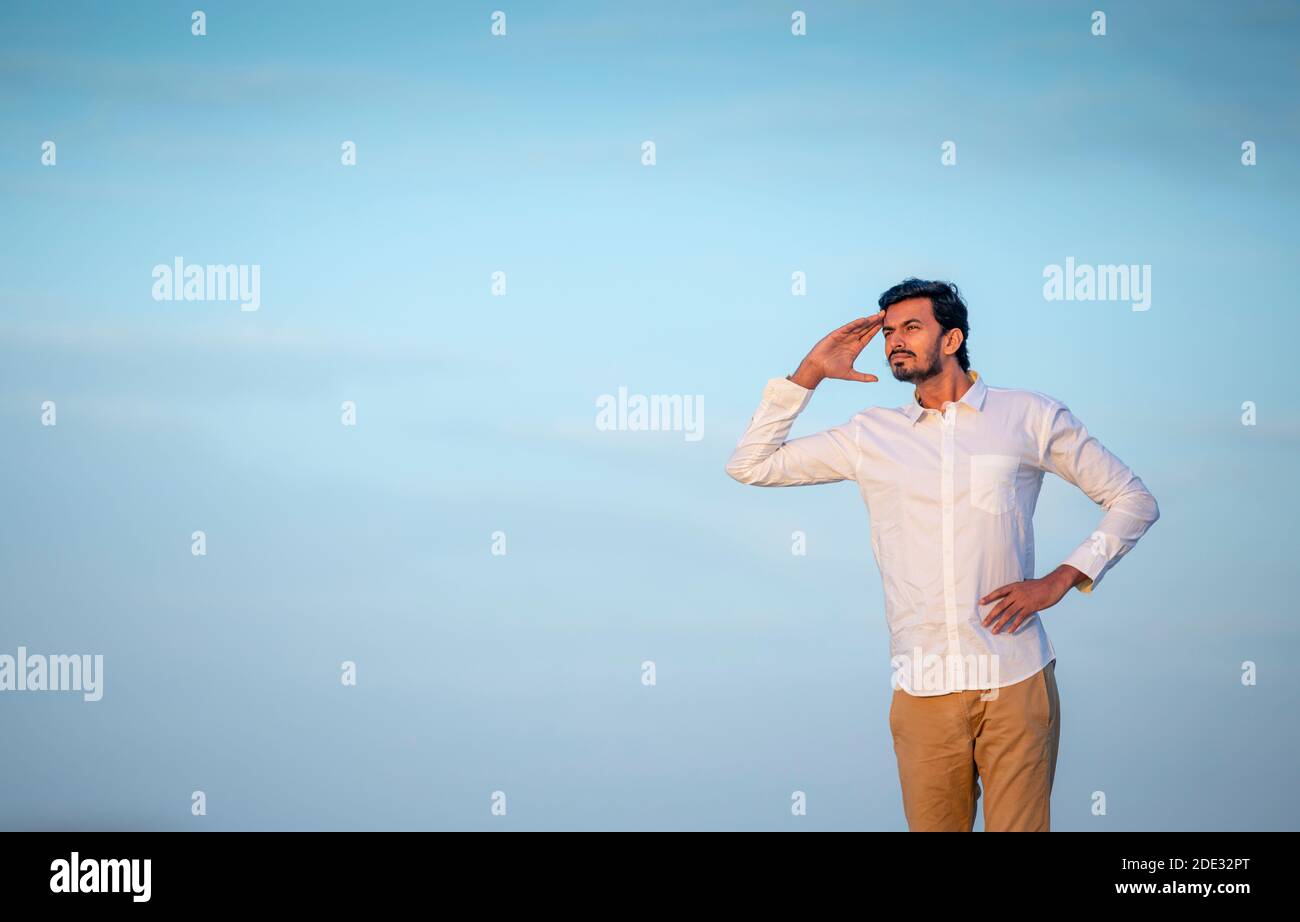 Man looking into distance Stock Photo - Alamy