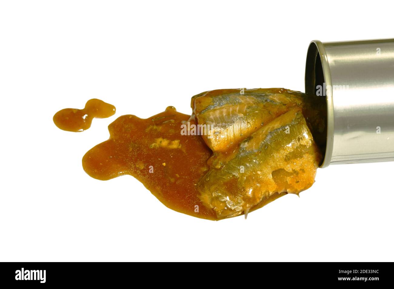 fish pouring from tin can on white background Stock Photo - Alamy