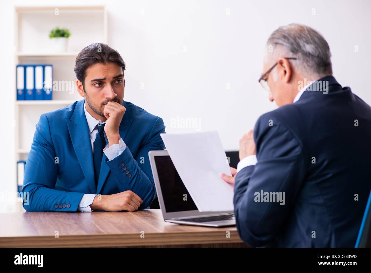 Male candidate employee meeting with old recruiter Stock Photo - Alamy