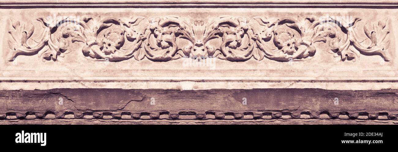 Detail of an old Italian molding stone eaves with foliage and plants ...