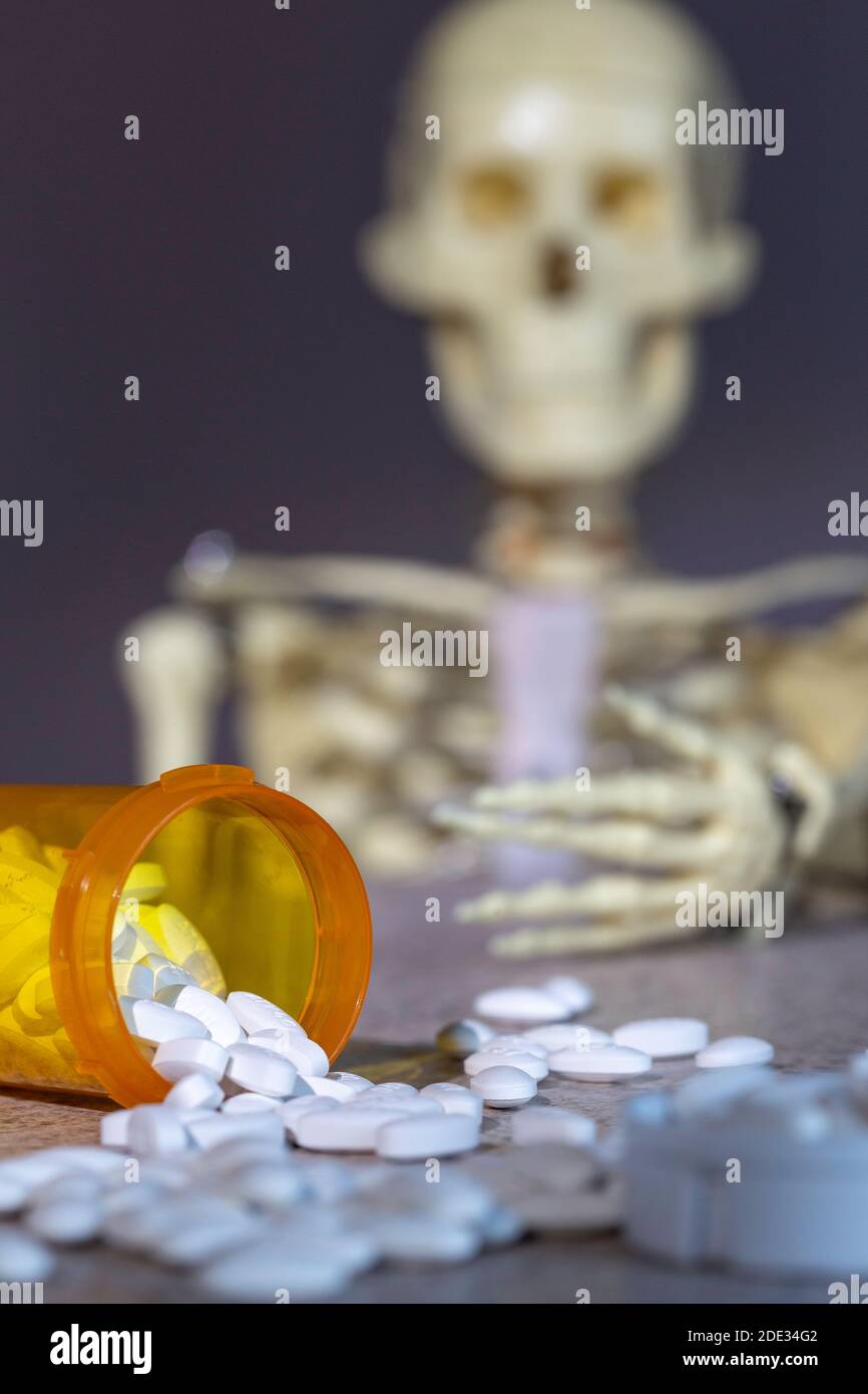 Close up of pill bottle with skeleton in background, USA Stock Photo ...