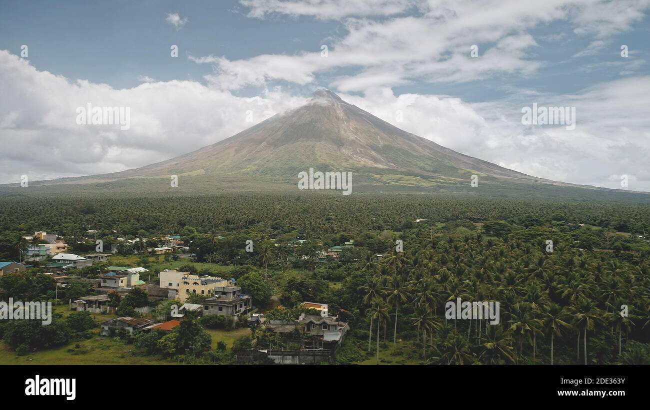 Tropic countryside with palm trees aerial. Mayon volcano hillside ...