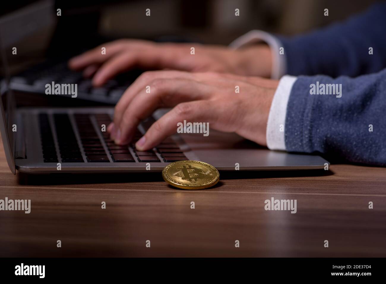 Male hacker hacking security firewall late in the office Stock Photo ...