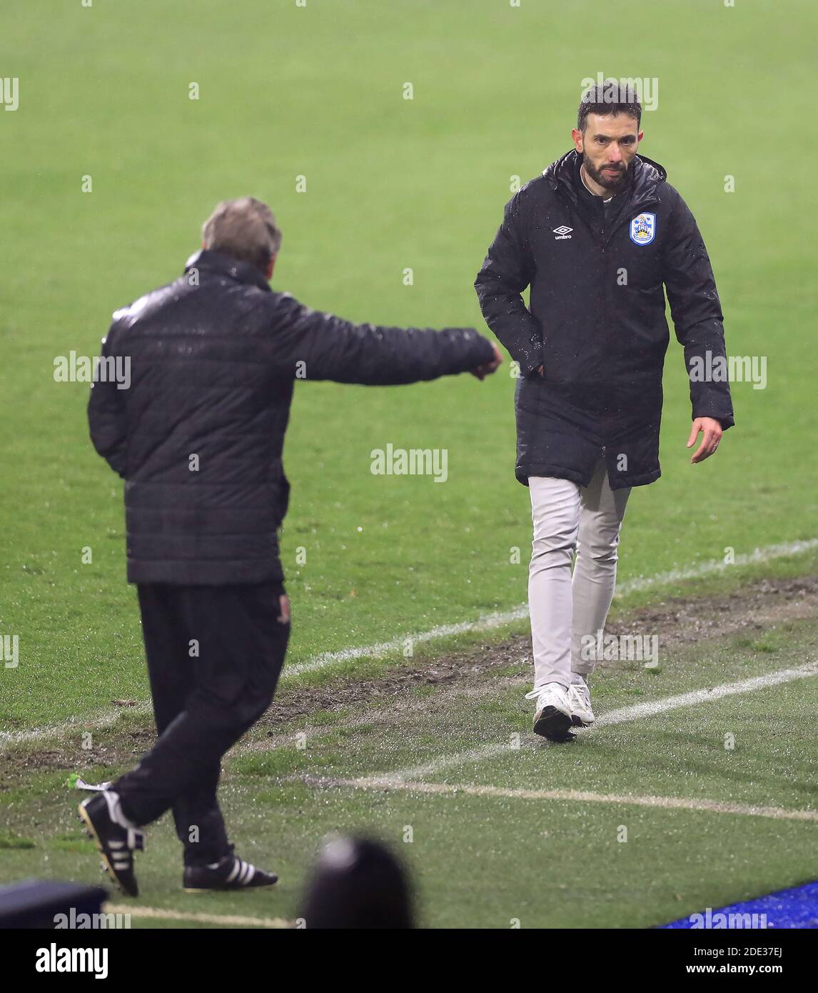 Middlesbrough manager Neil Warnock (left) and Huddersfield Town manager ...