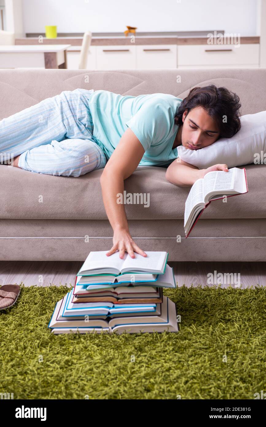 Young student being tired preparing for exams at home Stock Photo - Alamy