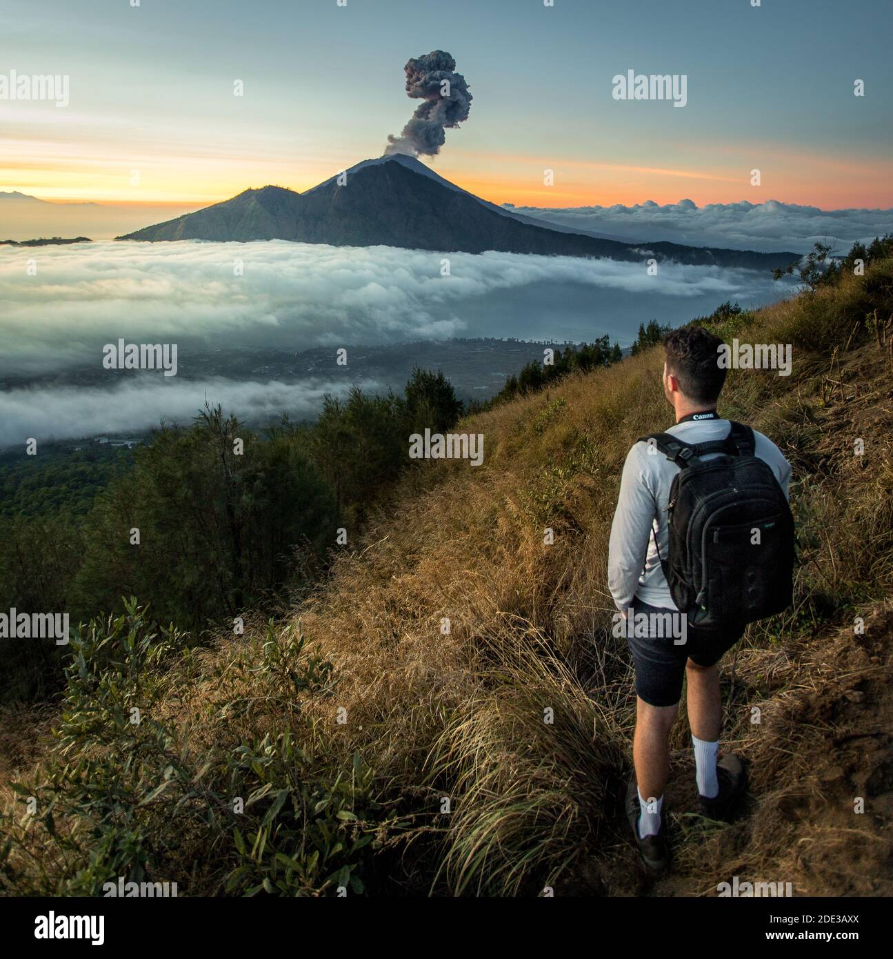 Volcano eruption at sunrise. Mount Agung, Bali, Indonesia Stock Photo ...