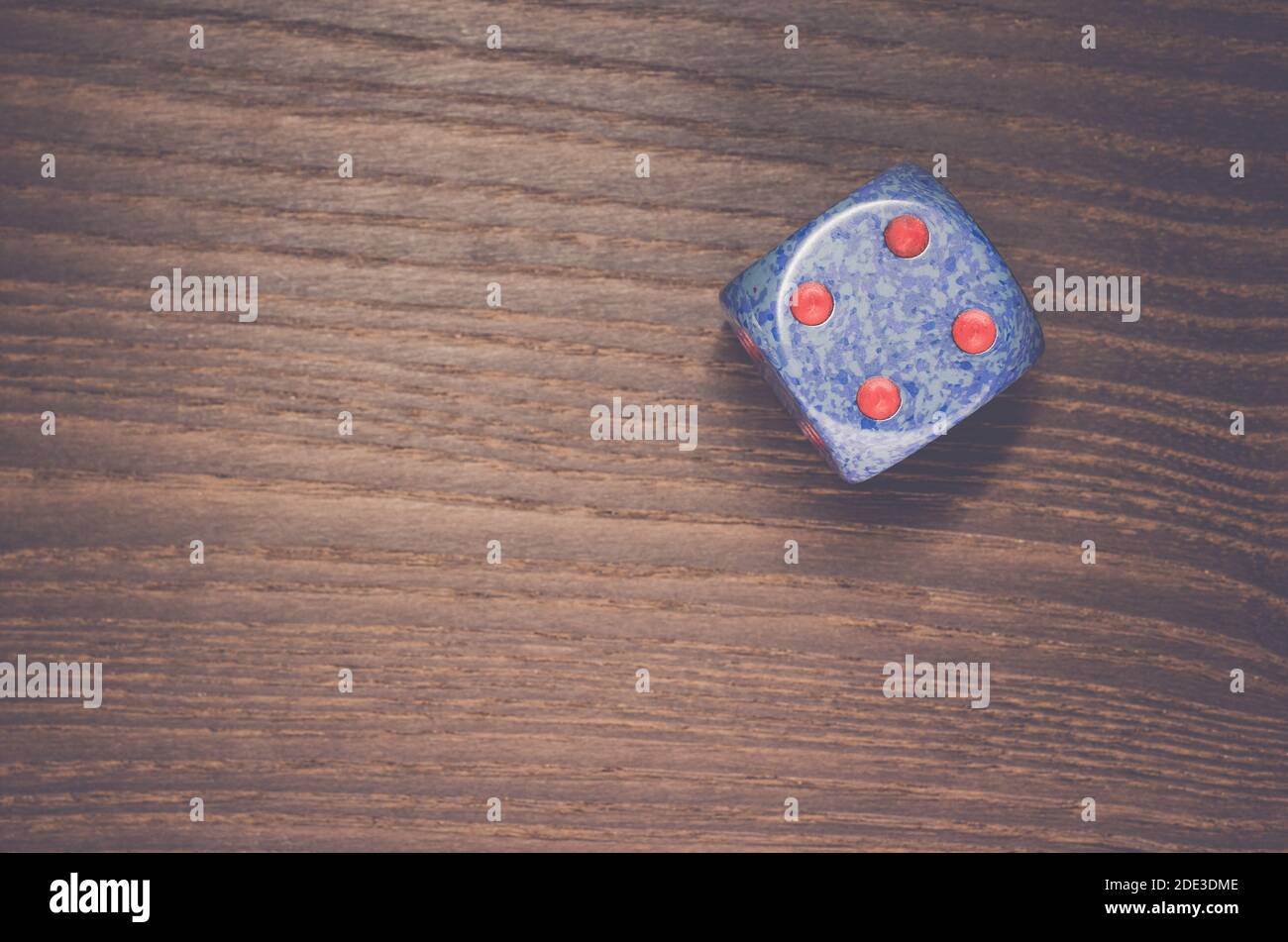 An overhead shot of dice on a wooden table Stock Photo - Alamy