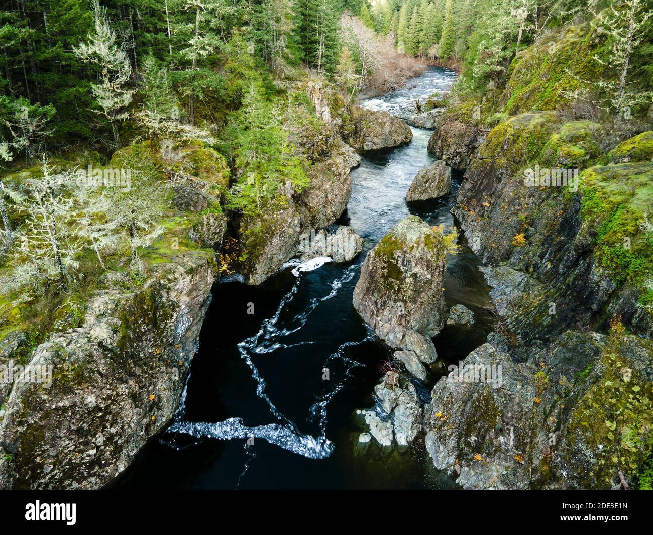 A river surrounded by rocks and trees in Sooke Potholes Provincial Park ...
