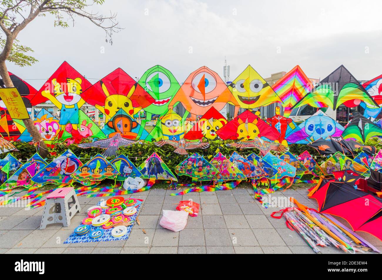 Different types of cartoon character kites sold at a street in ...