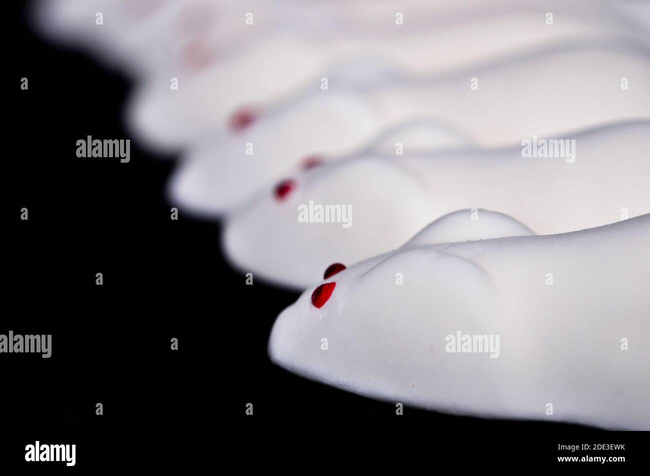A group of white mice with red eyes from marshmallow, close up, looking ...