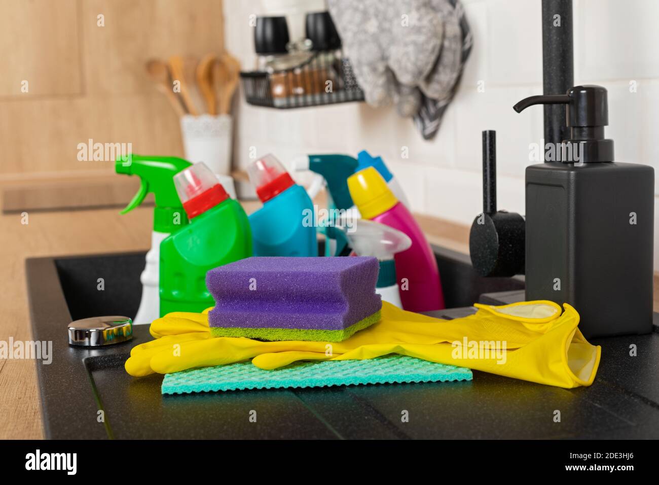 Colorful cleaning products in the kitchen Stock Photo - Alamy