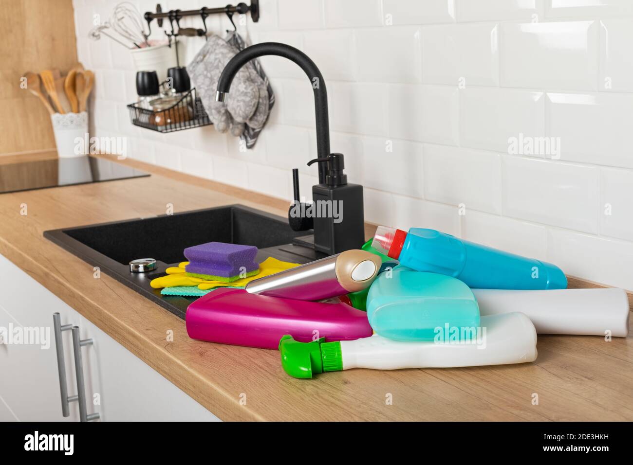 Colorful cleaning products in the kitchen Stock Photo - Alamy
