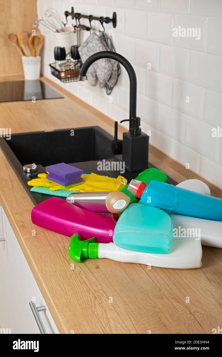 Colorful cleaning products in the kitchen Stock Photo - Alamy