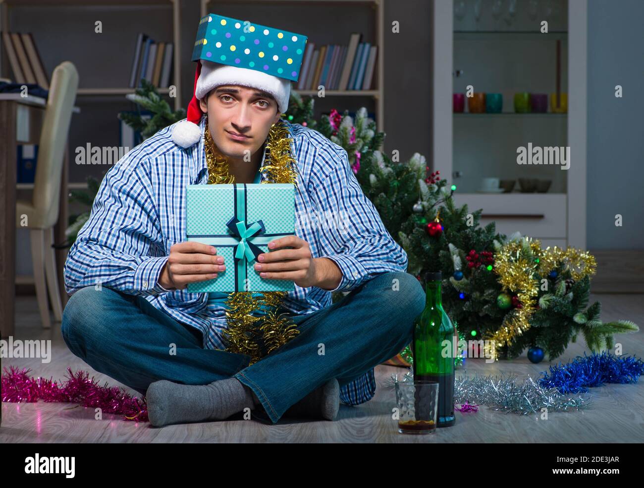 The man celebrating christmas at home alone Stock Photo - Alamy