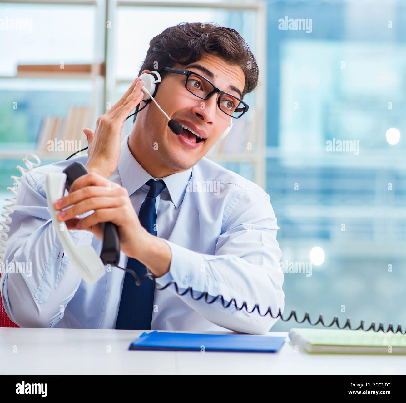 The unhappy angry call center worker frustrated with workload Stock ...