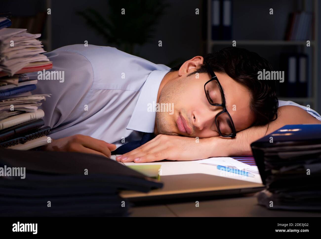 The young businessman working overtime late in office Stock Photo - Alamy