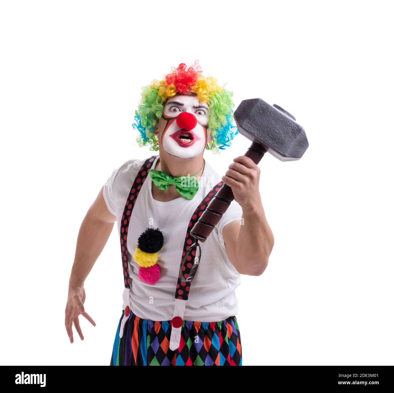 The funny clown with a hammer isolated on white background Stock Photo ...