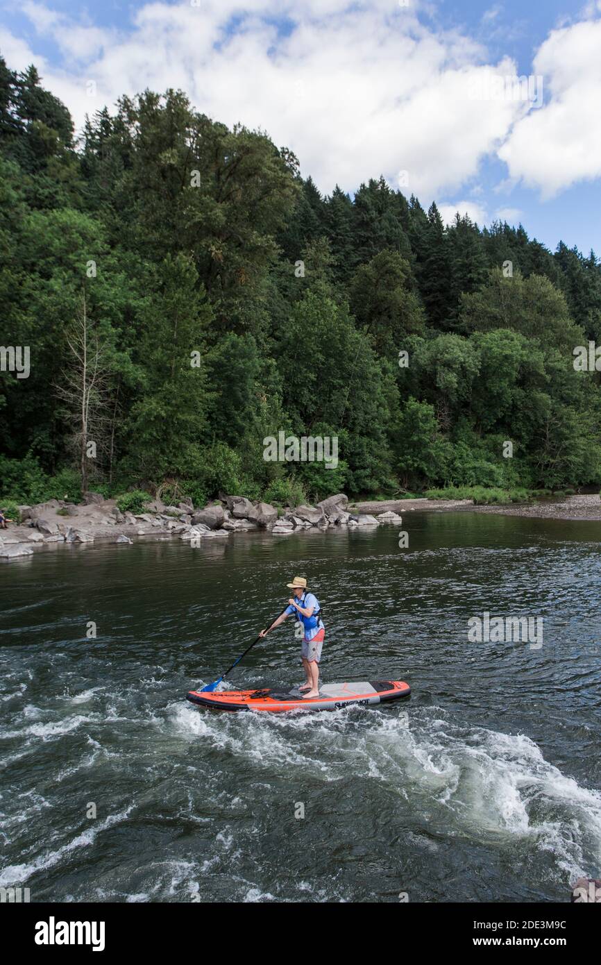 Man on paddleboard in a river hi-res stock photography and images - Alamy