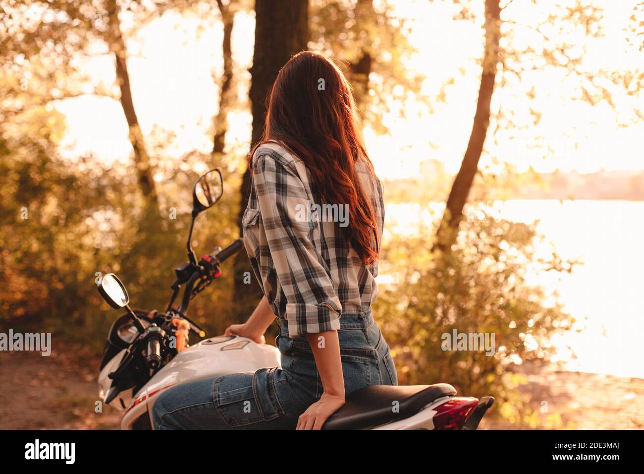 Woman Sitting On Back Motorbike High Resolution Stock Photography and ...