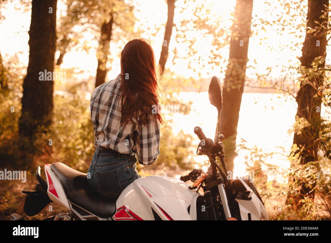 Woman sitting on back motorbike hi-res stock photography and images - Alamy