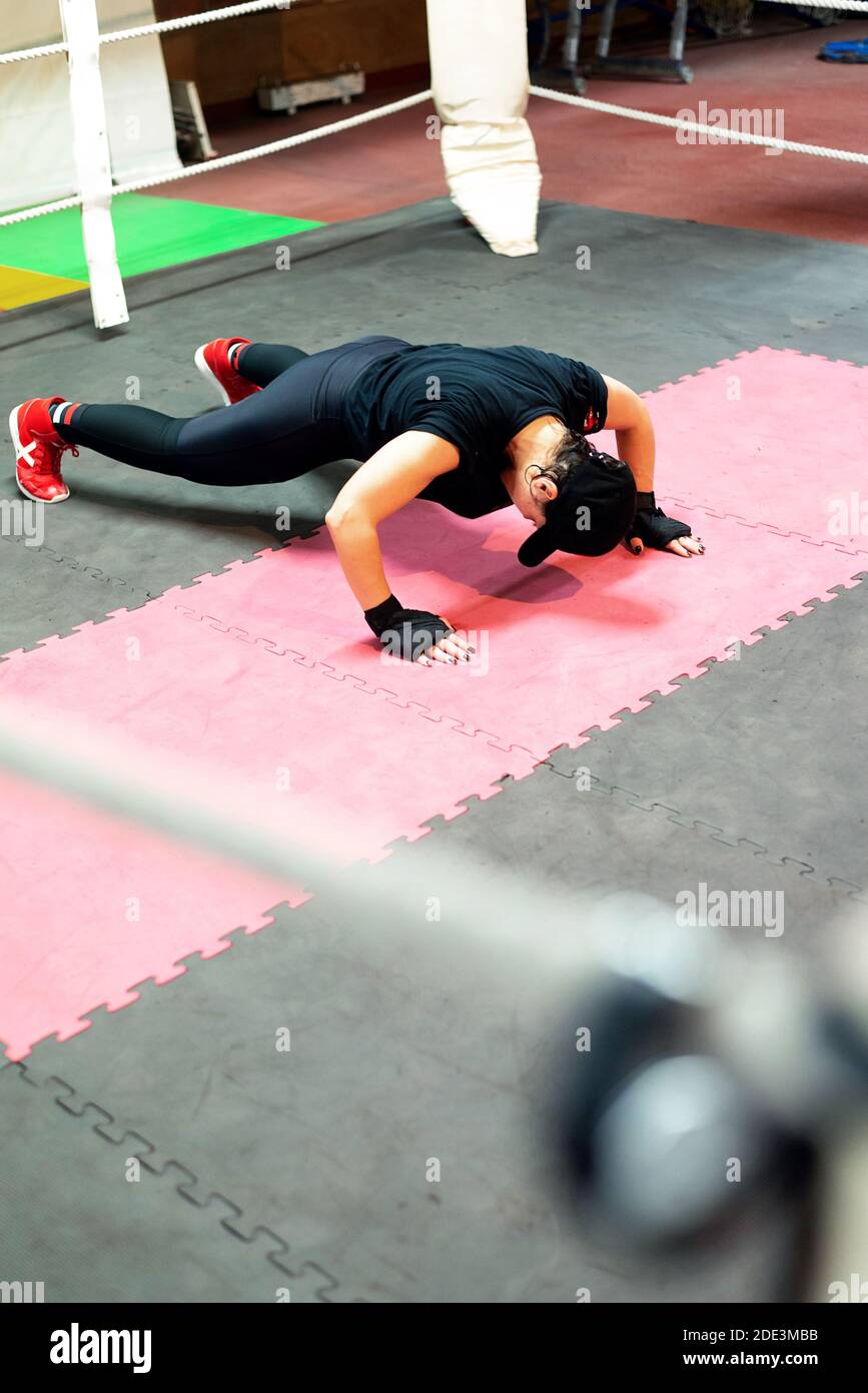 Real woman on boxing training doing push ups Stock Photo - Alamy