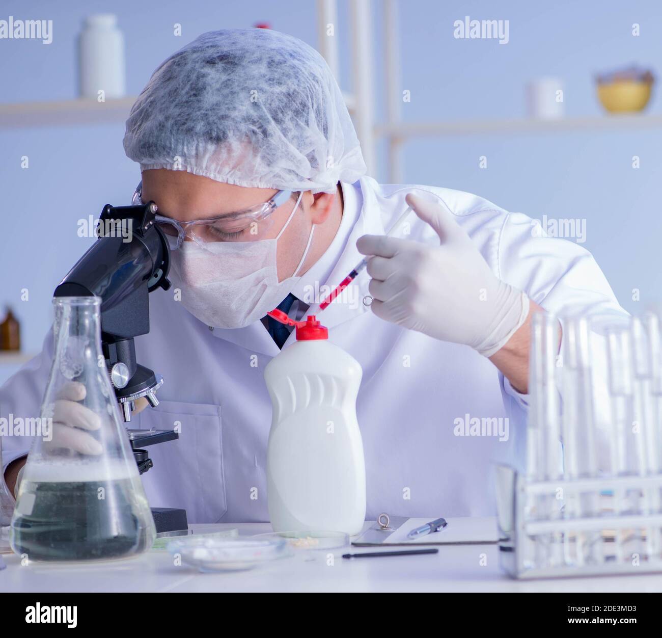 The man in the lab testing new cleaning solution detergent Stock Photo ...