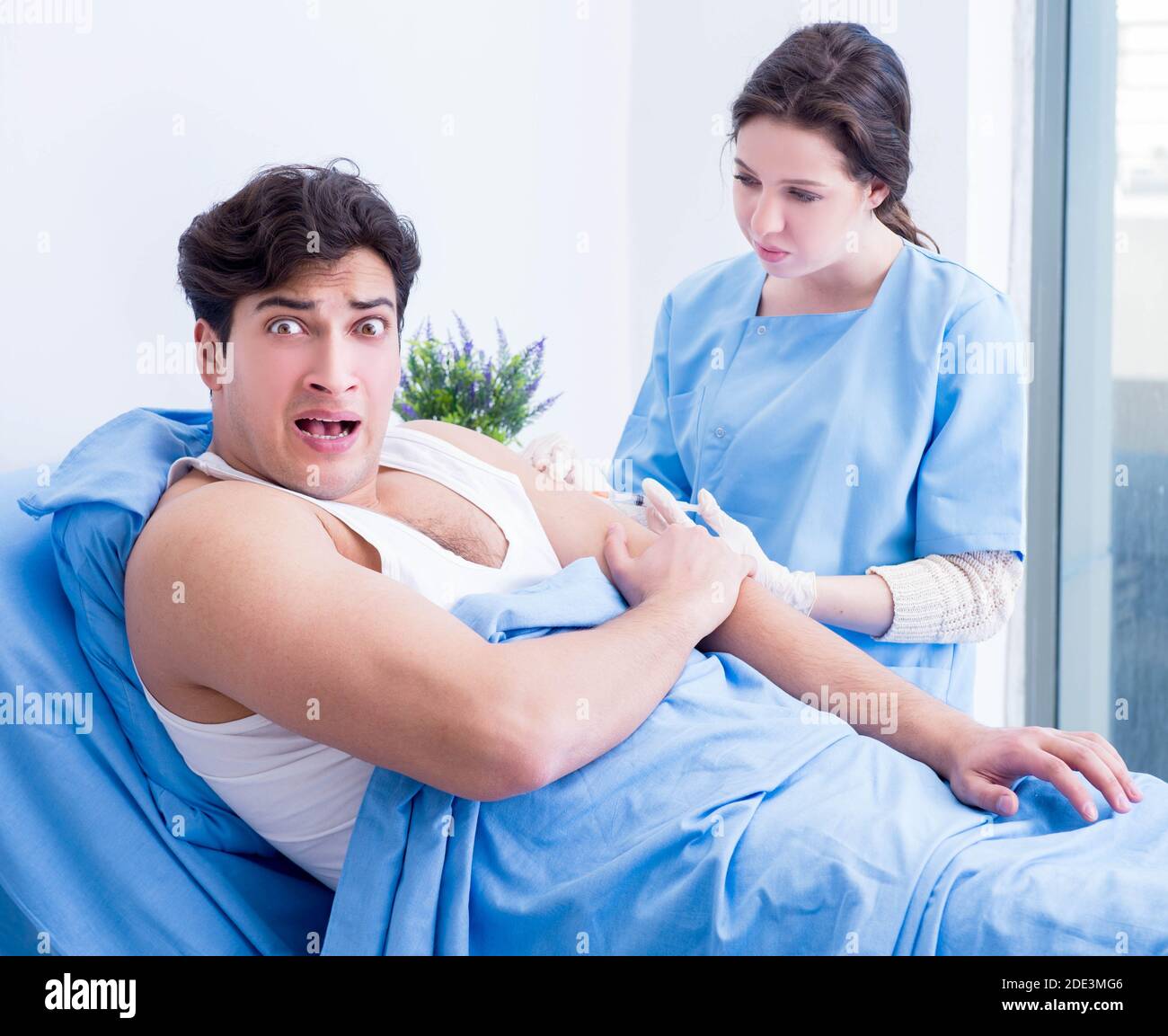 The doctor doing medical injection in hospital room Stock Photo - Alamy