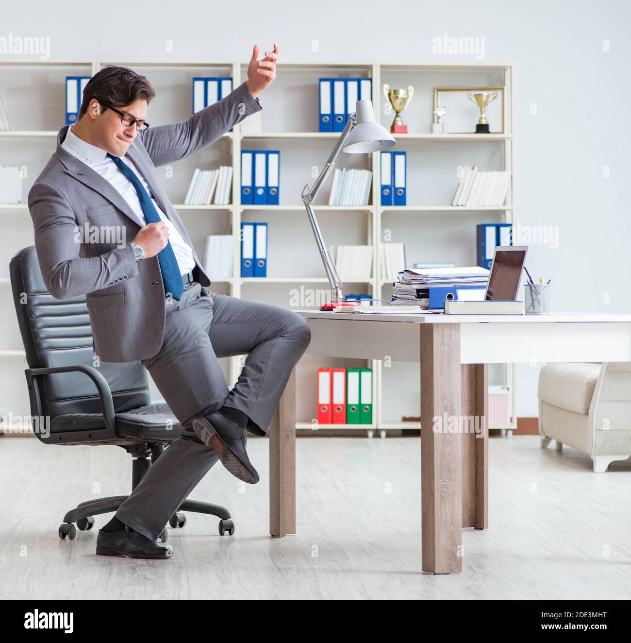 The businessman having fun taking a break in the office at work Stock ...