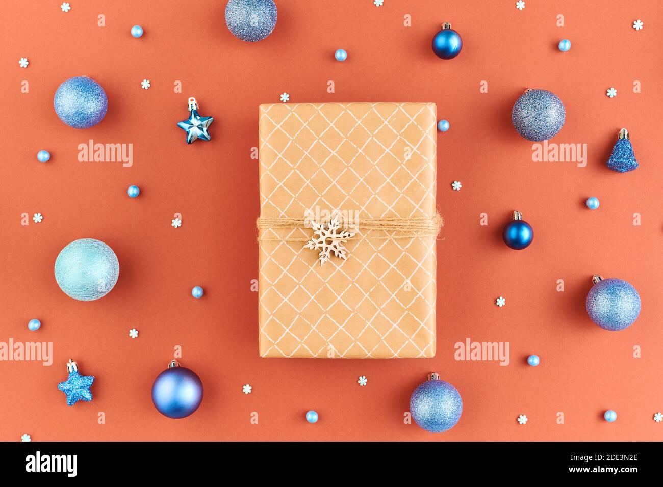Flat layout of box with Christmas gift with wooden decoration on top ...