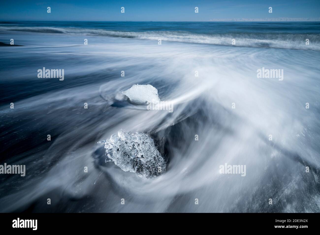 Chunk of ice on sea shore at Diamond beach near Jokulsarlon Glacier ...