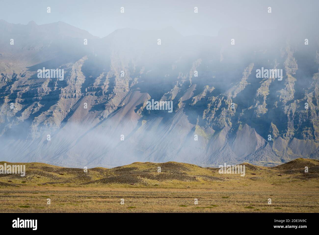 Mountains peeking through mist, Iceland Stock Photo - Alamy