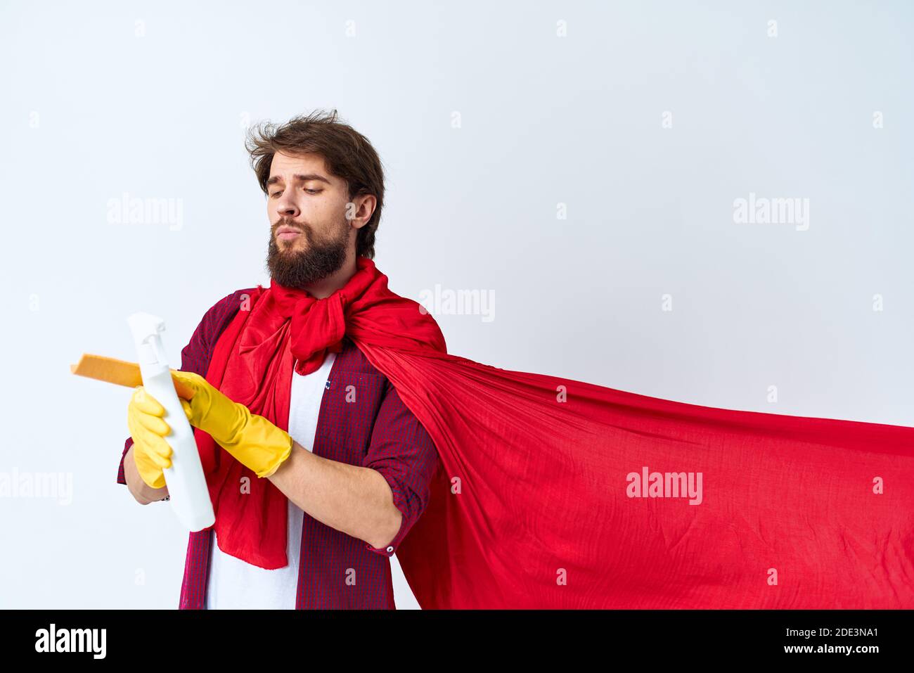 cleaner wearing a red coat detergent service housework cropped view ...