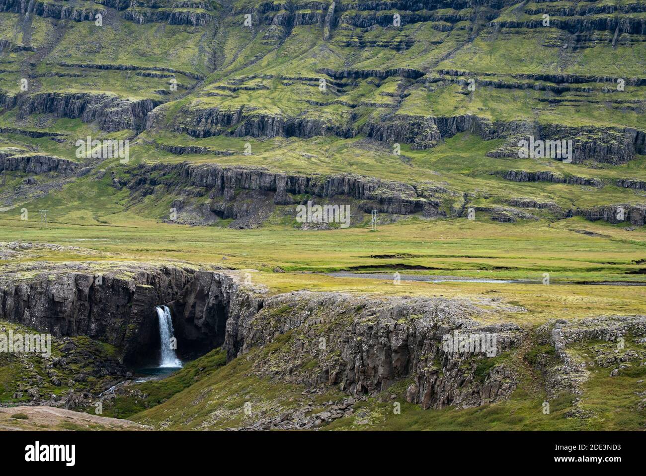 Scenic view of Folaldafoss waterfall and landscape, eastern Region ...