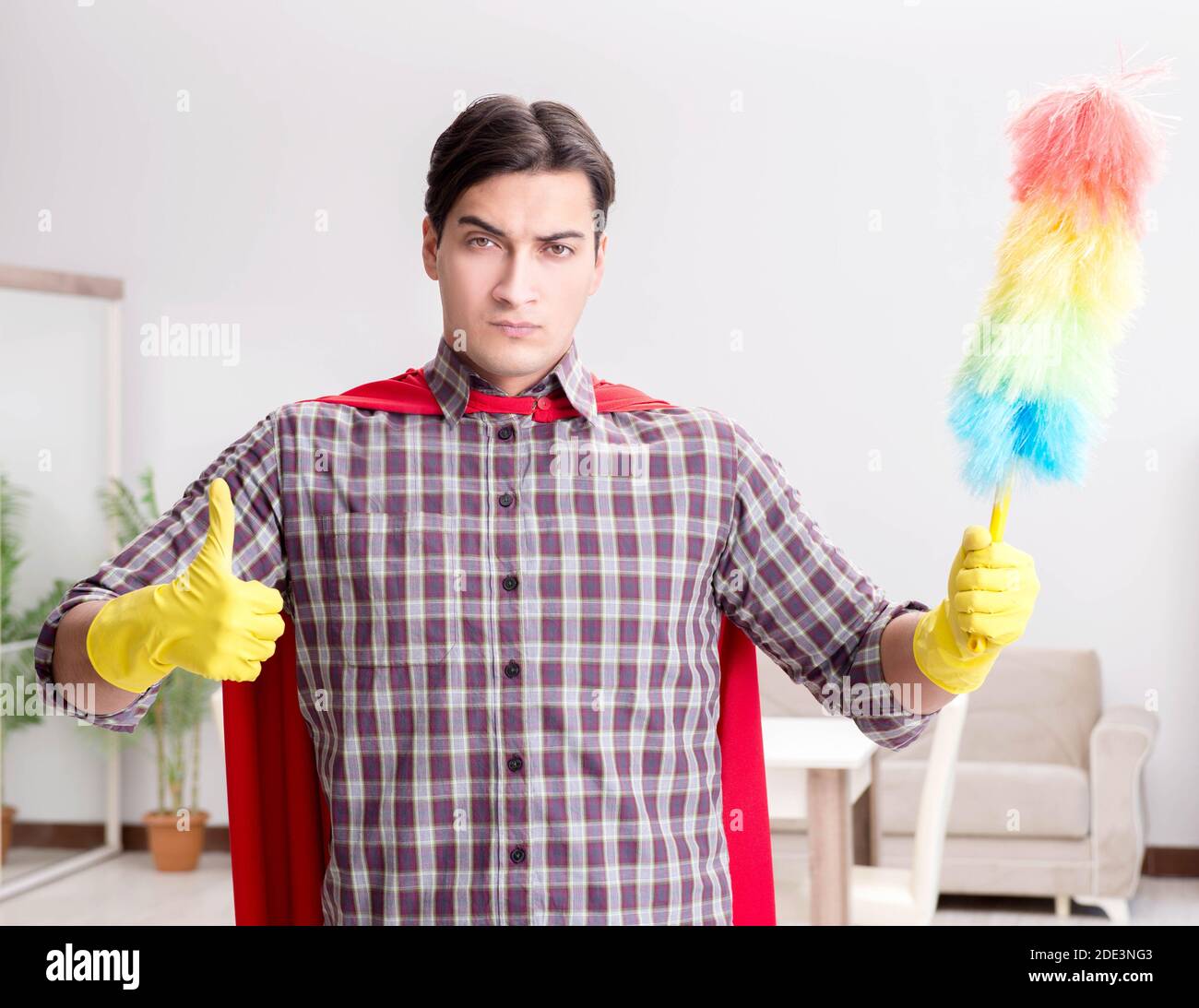 The the super hero cleaner doing housework Stock Photo - Alamy