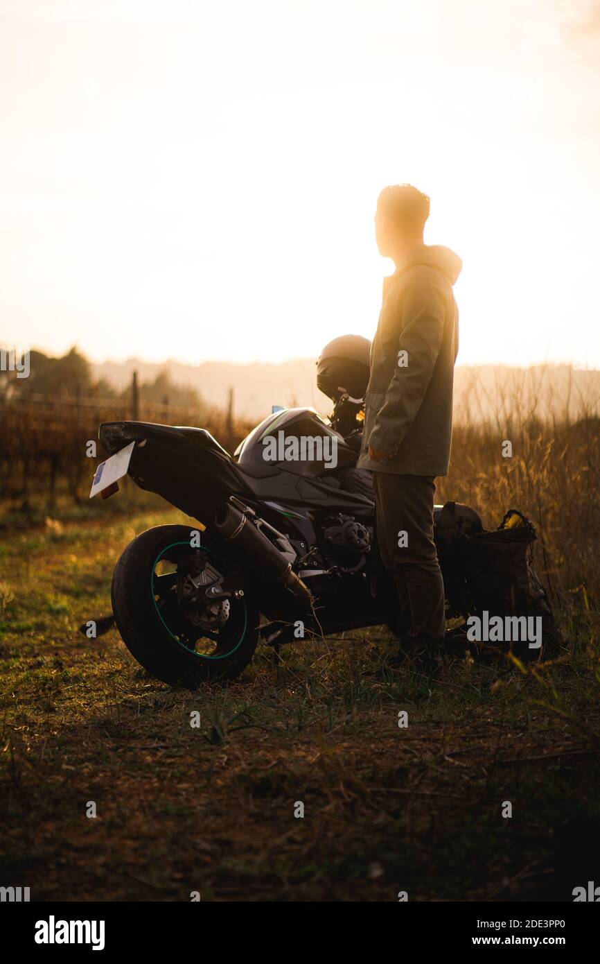 Standing with motorbike hi-res stock photography and images - Alamy