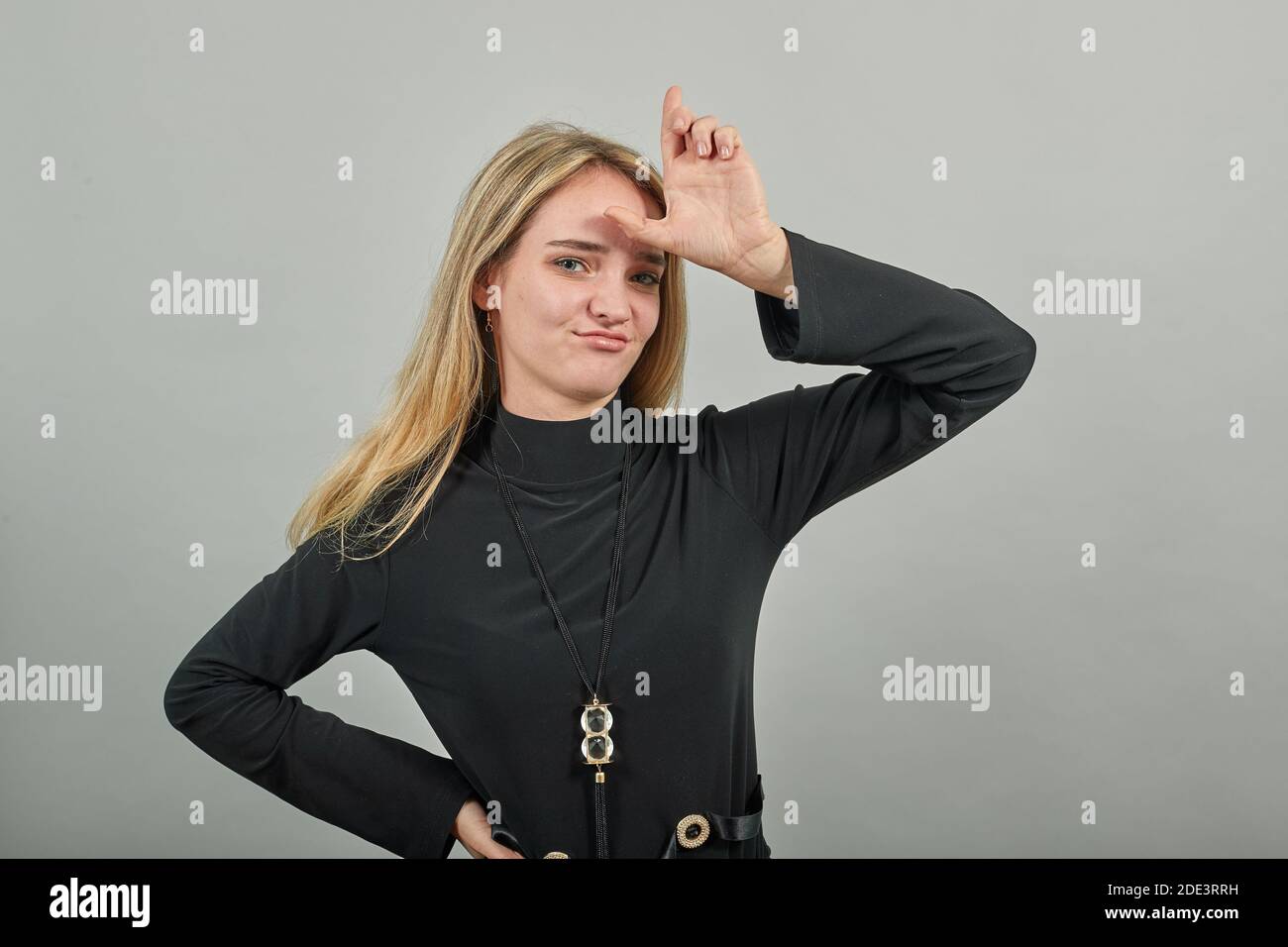 Showing loser sign, displaying dud gesture, alpha. Two fingers 2 ...