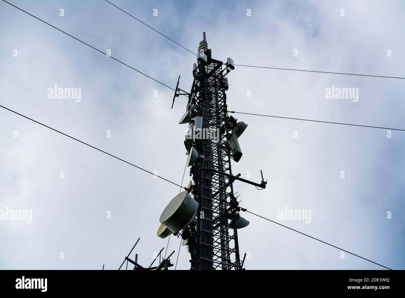 Large cellular communications tower with arrays and dishes Stock Photo ...
