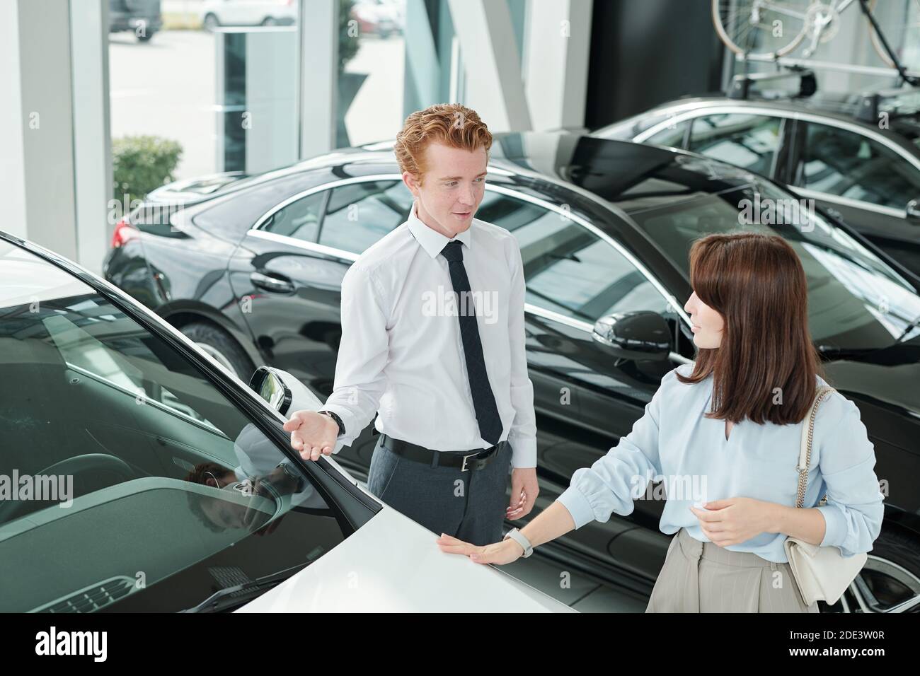 Elegant female auto dealership hi-res stock photography and images - Alamy