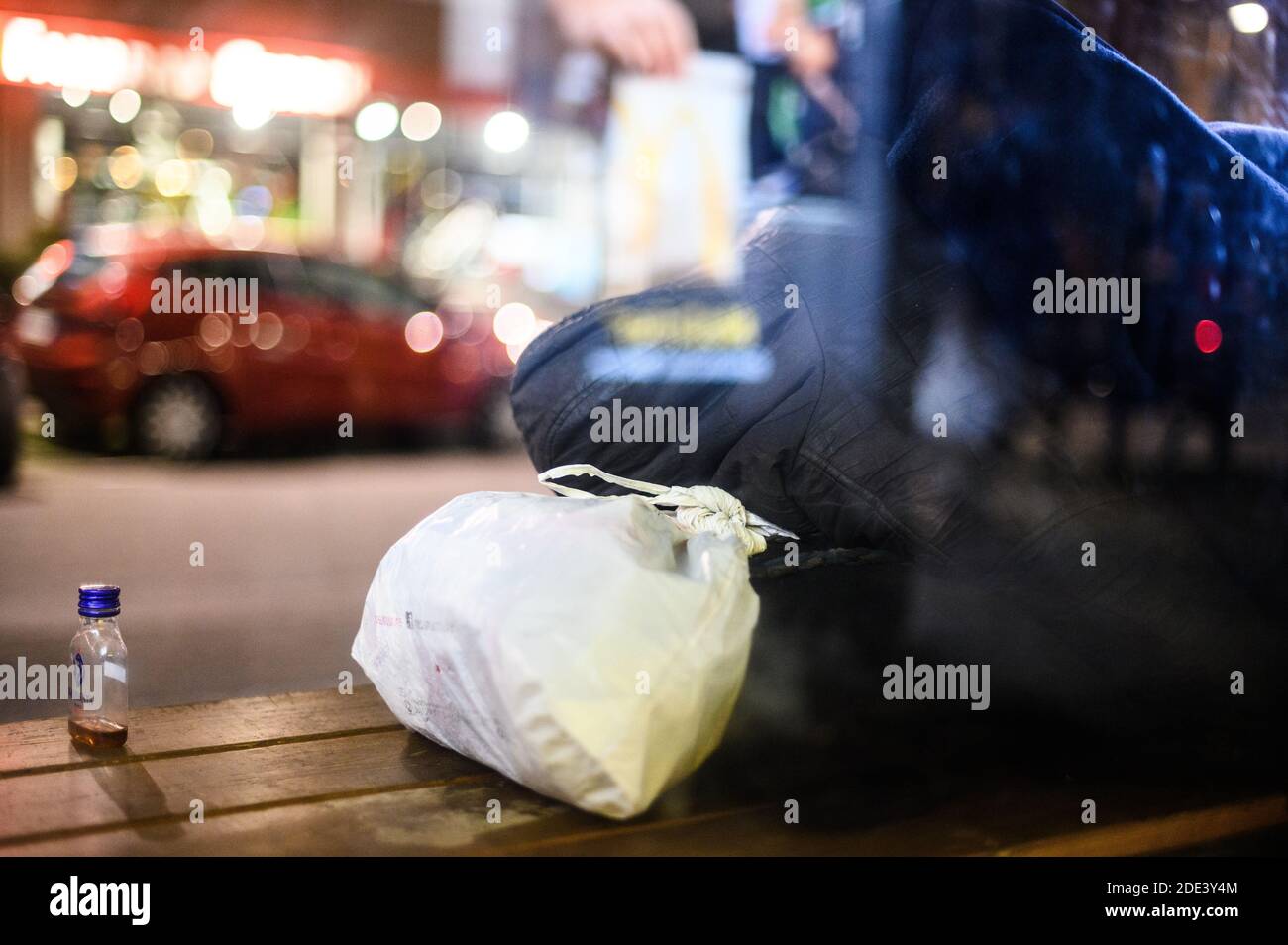 Homeless man sleeping bus stop hi-res stock photography and images - Alamy