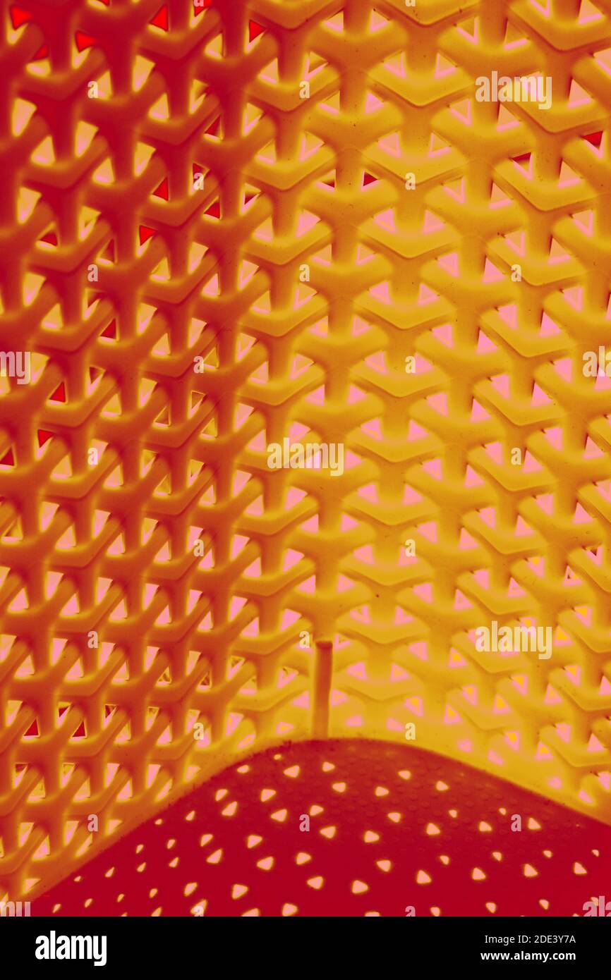 Multidimensional interwoven background pattern in deep red, gold and ...