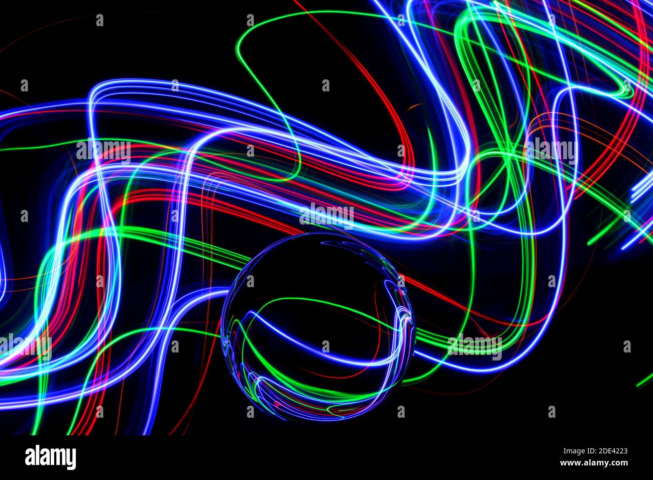 Long exposure photograph of neon multi colour in an abstract swirl ...