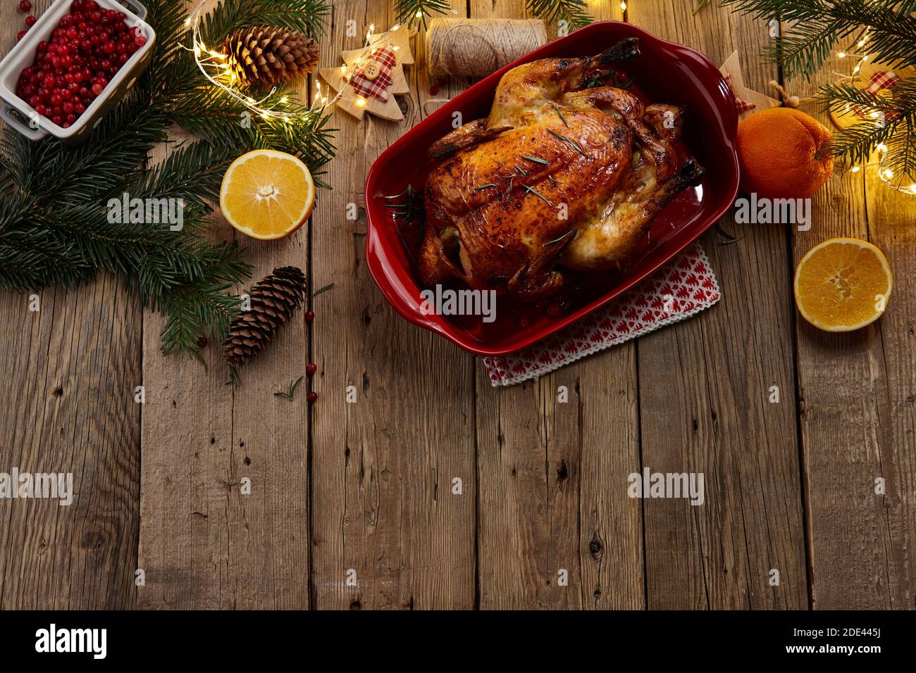 Roasted chicken on wooden rustic table for Christmas dinner Stock Photo ...