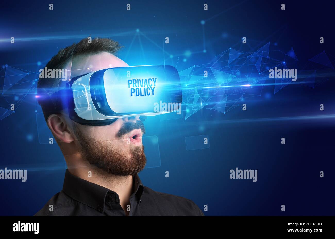 Businessman looking through Virtual Reality glasses with PRIVACY POLICY ...