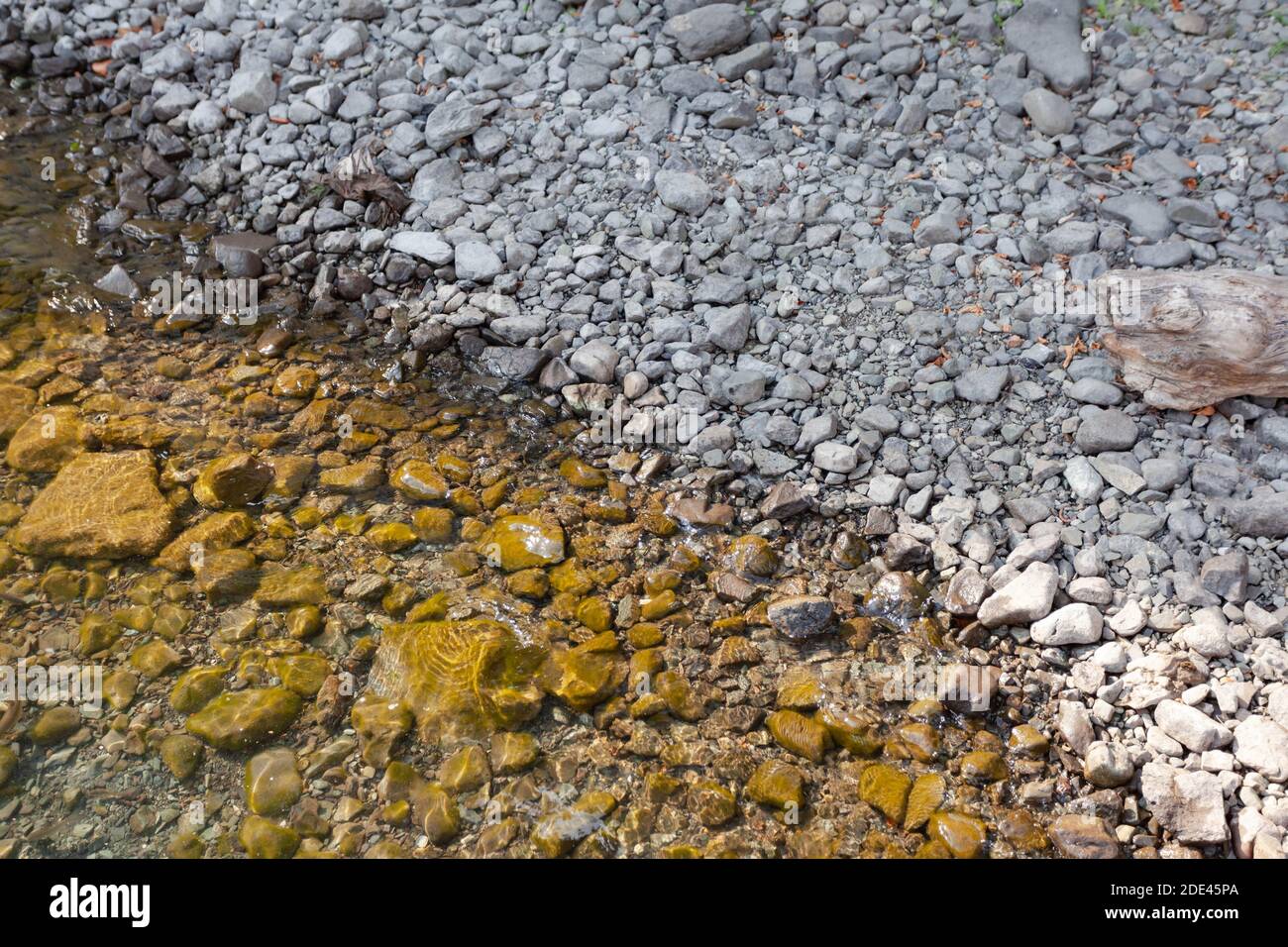 Wet and dry stones diagonally Stock Photo - Alamy