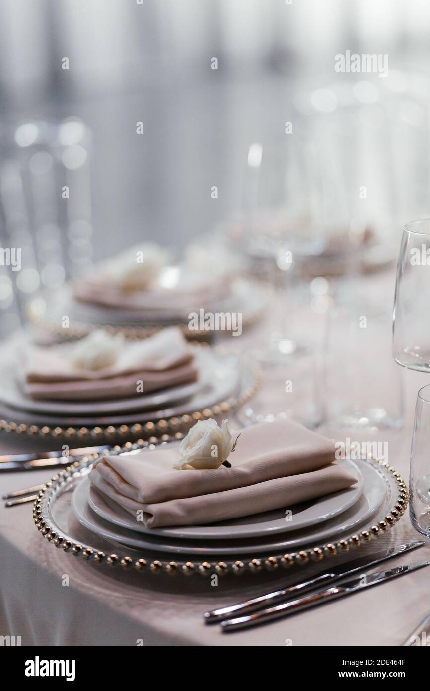 Set of plates on the wedding banquet. Luxury table set in the ...
