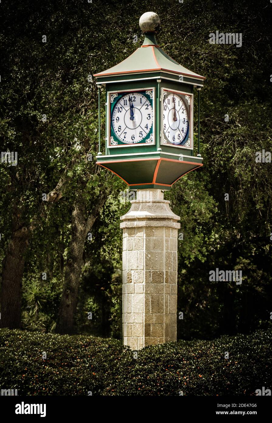 A clock tower on a coquina stone plinth on Town Square, surrounded by ...