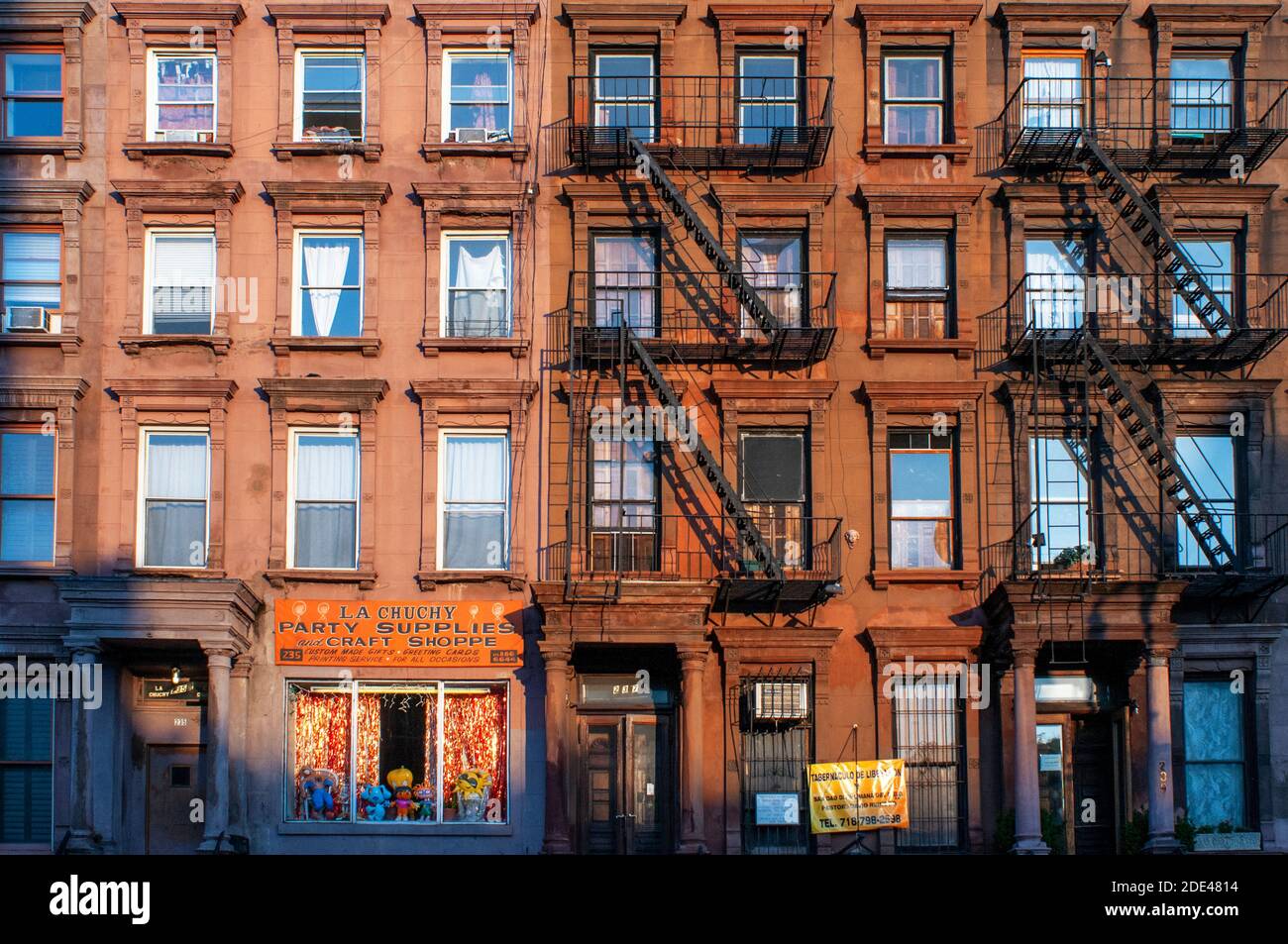 Fire escapes on tenement apartment buildings in Harlem neighborhood ...