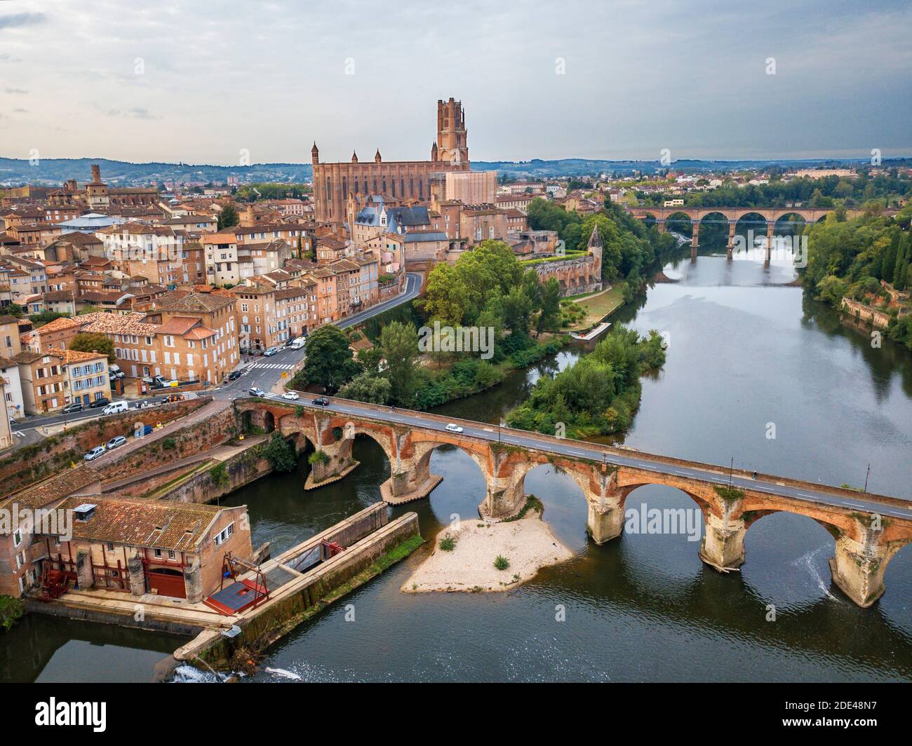 The Tarn River crossing Albi town. Pont Vieux bridge and the Church of ...