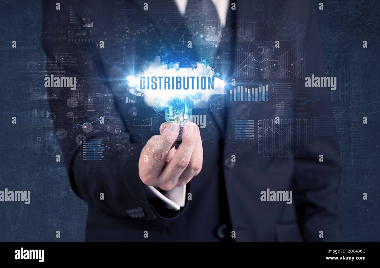 Businessman holding a light bulb with DISTRIBUTION inscription, new ...